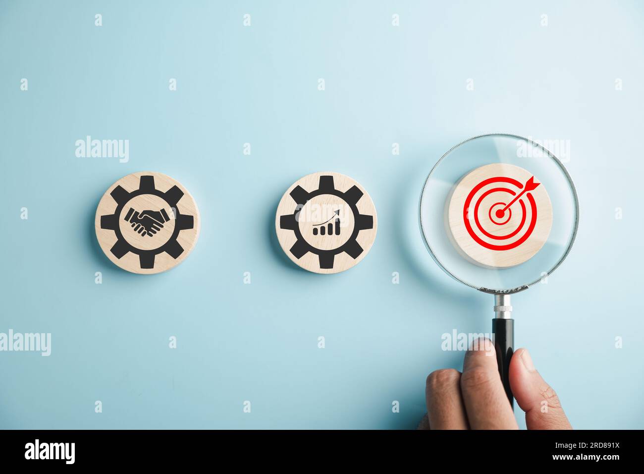 Target icon under magnifying glass Stock Photo - Alamy