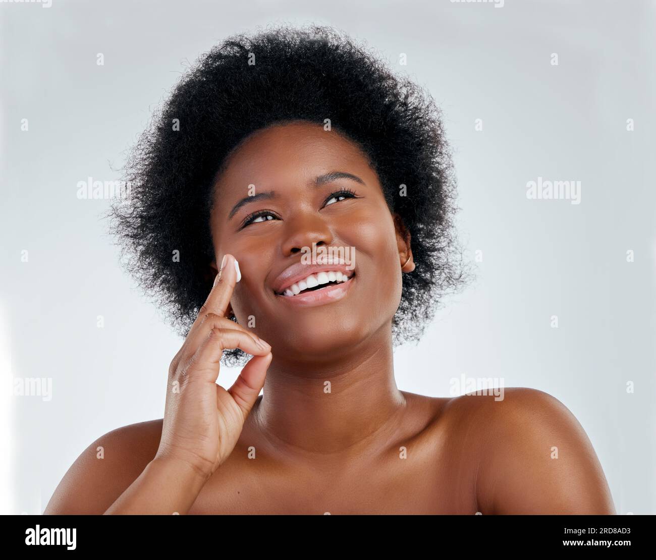 Face, skincare and black woman with cream in studio isolated on white ...