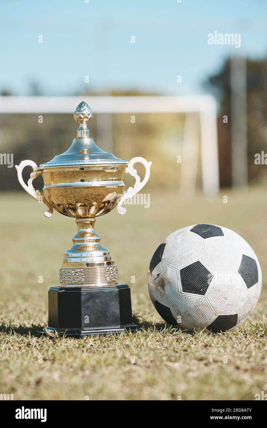 Success, field and football and trophy for sports, game award and ...