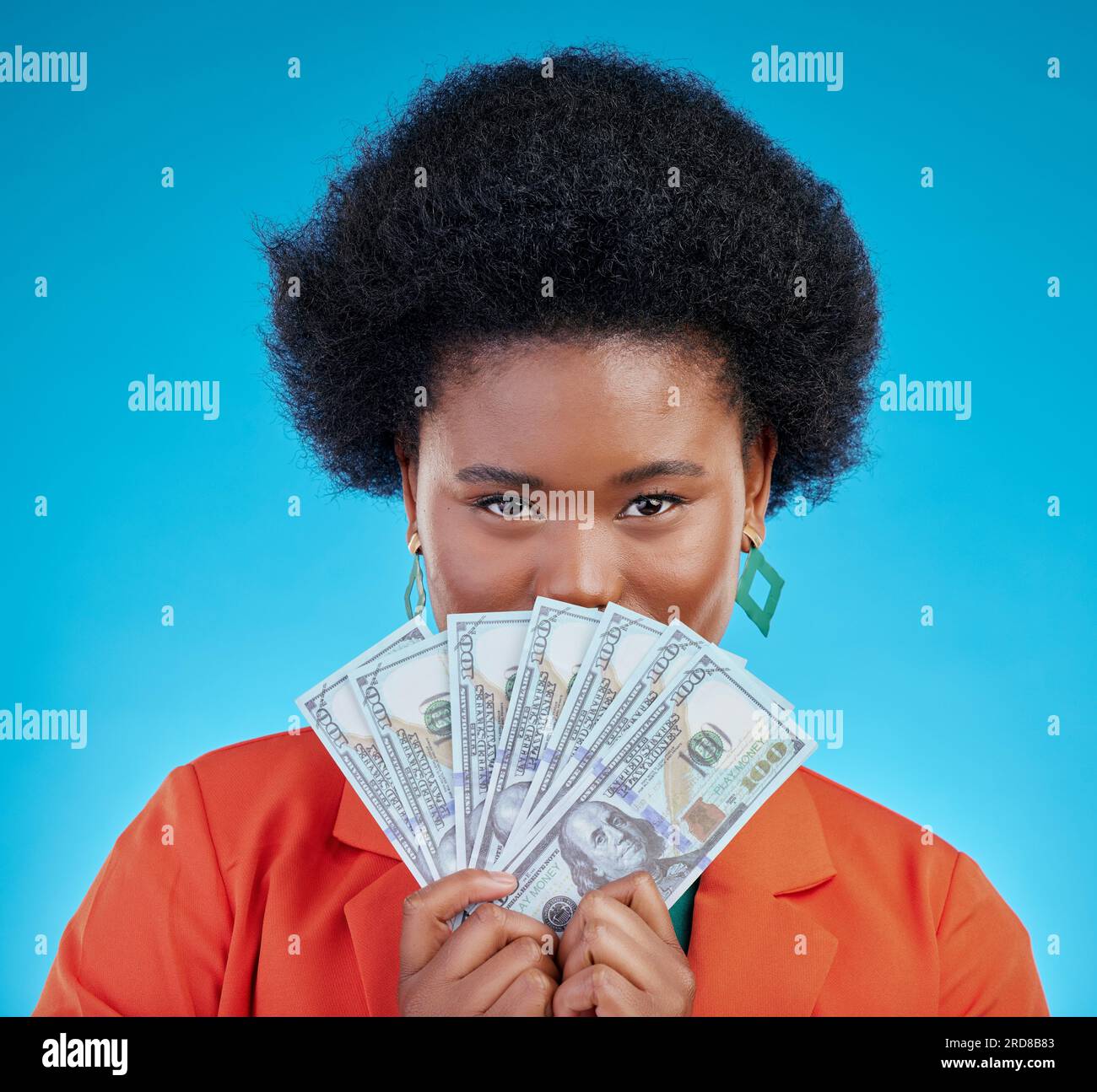 Money, winner and woman cover face on blue, studio background for ...