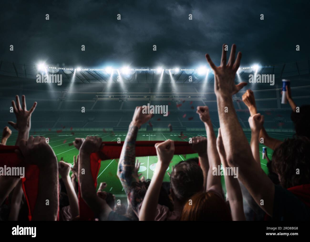 Football scene at night match with with cheering fans at the stadium ...