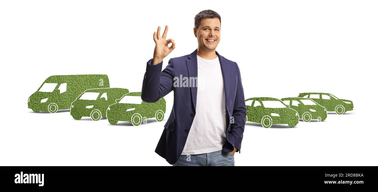 Man gesturing ok sign in front of green eco friendly vehicles isolated ...
