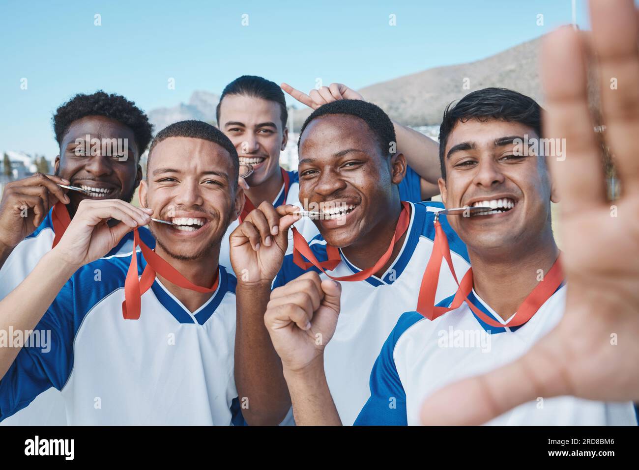 Men in selfie, medal and winner, soccer competition and sports, athlete ...