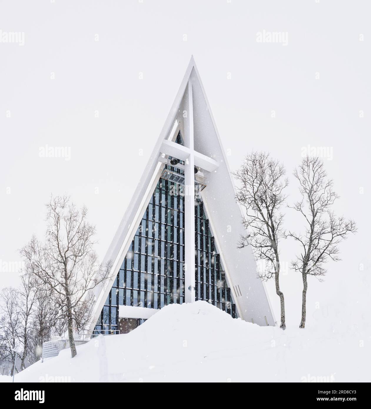 Snowy facade of the Arctic Cathedral decorated with glass windows ...