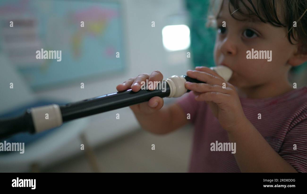 Baby playing flute hi-res stock photography and images - Alamy