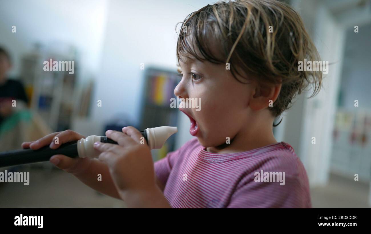 Baby playing flute hi-res stock photography and images - Alamy