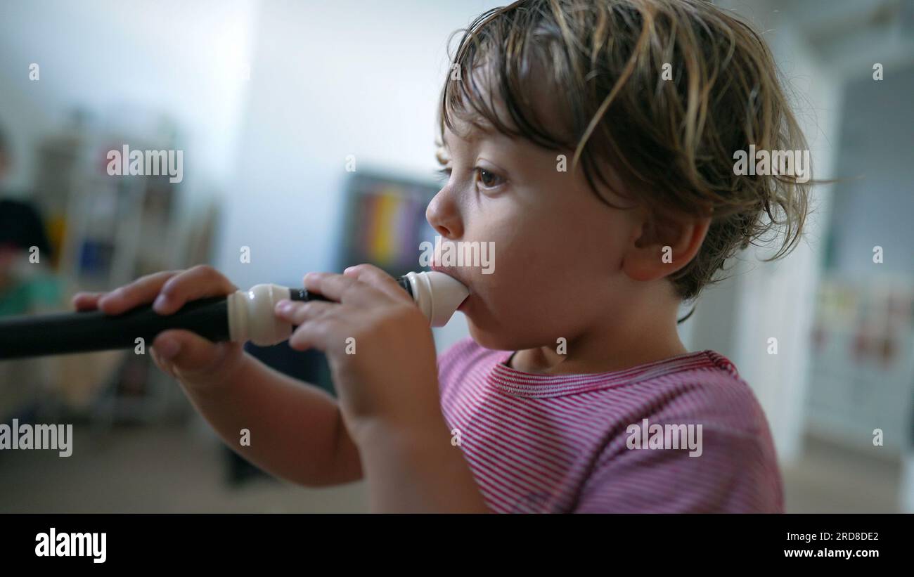 Baby playing flute hi-res stock photography and images - Alamy