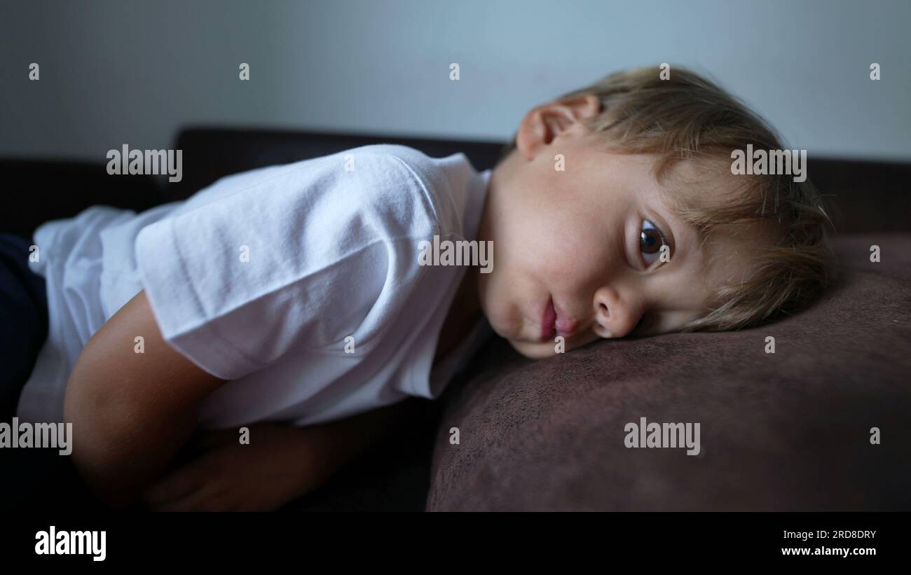 Child on couch resting preparing to sleep restful little kid on sofa ...