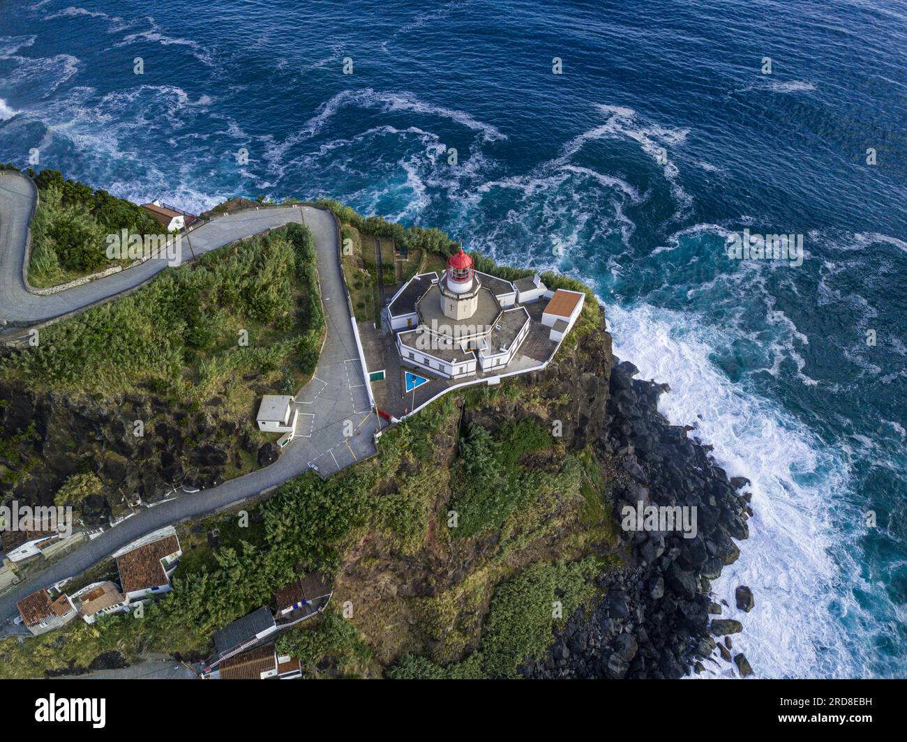 Aerial view of Farol do Arnel lighthouse and Arnel point, Sao Miguel island, Azores, Portugal ...