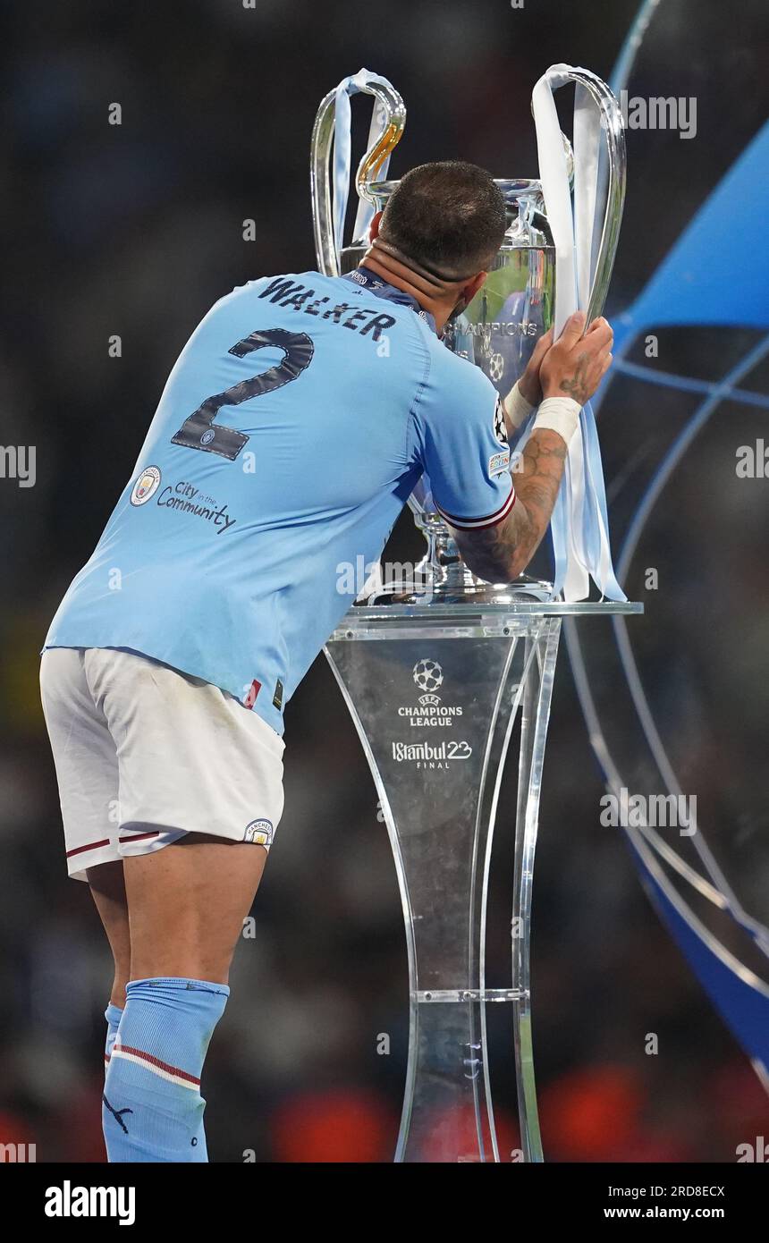 Manchester City's Kyle Walker kisses the Champions League Trophy after ...