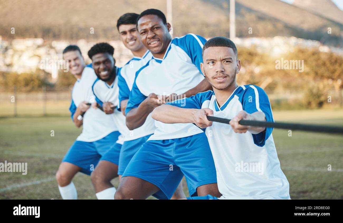 Soccer player, men and tug of war on field with teamwork, strong and ...