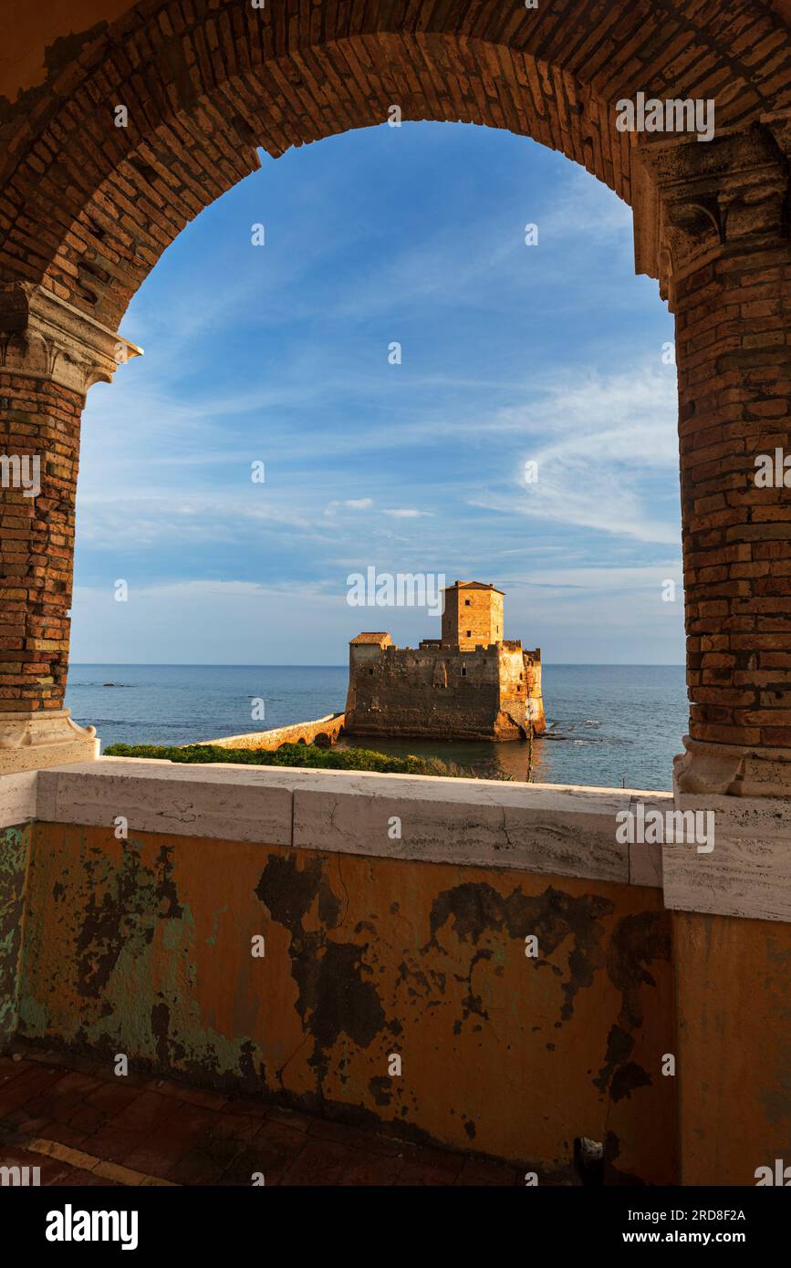 Torre Astura medieval castle seen from an arch made of bricks ...