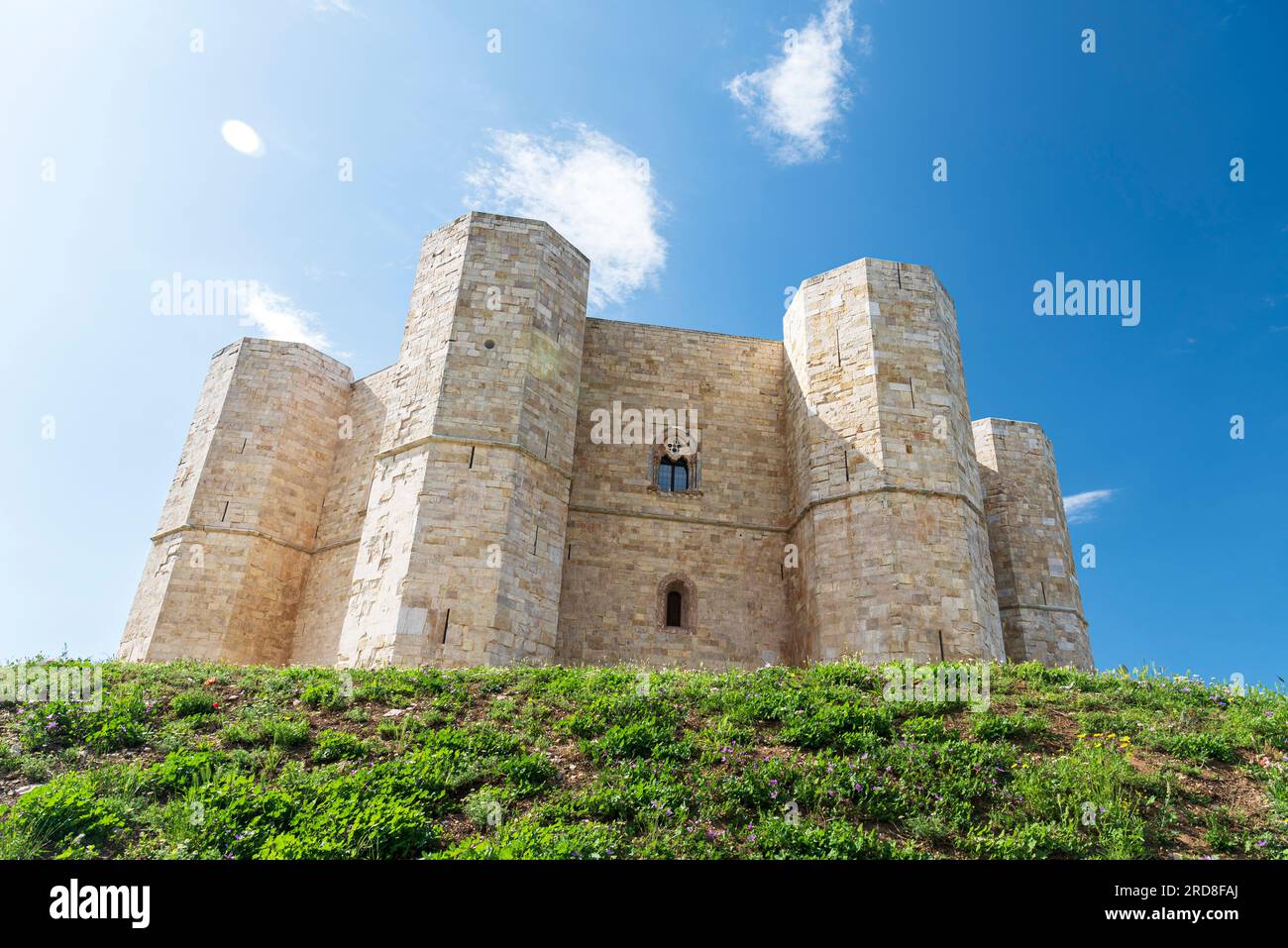 View from below of the octagonal white castle of Castel del Monte ...