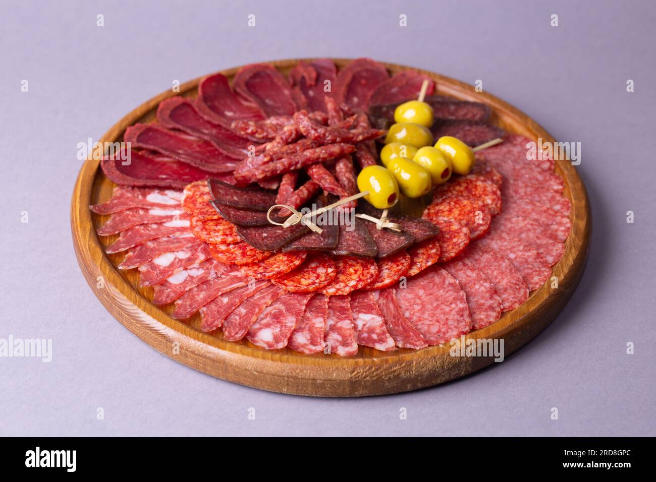 meat sliced from delicacies on a wooden stand Stock Photo - Alamy