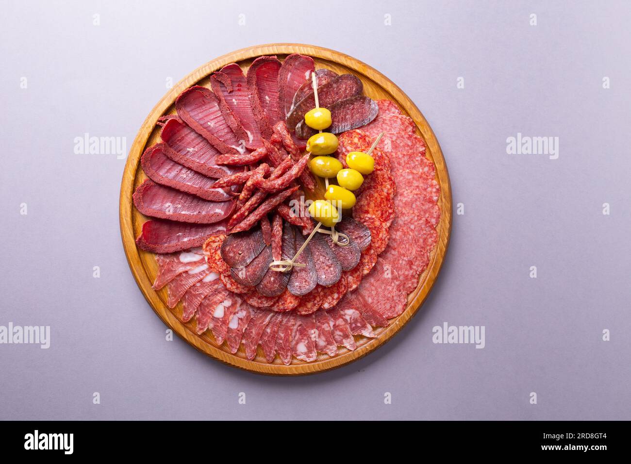 meat sliced from delicacies on a wooden stand top view Stock Photo - Alamy