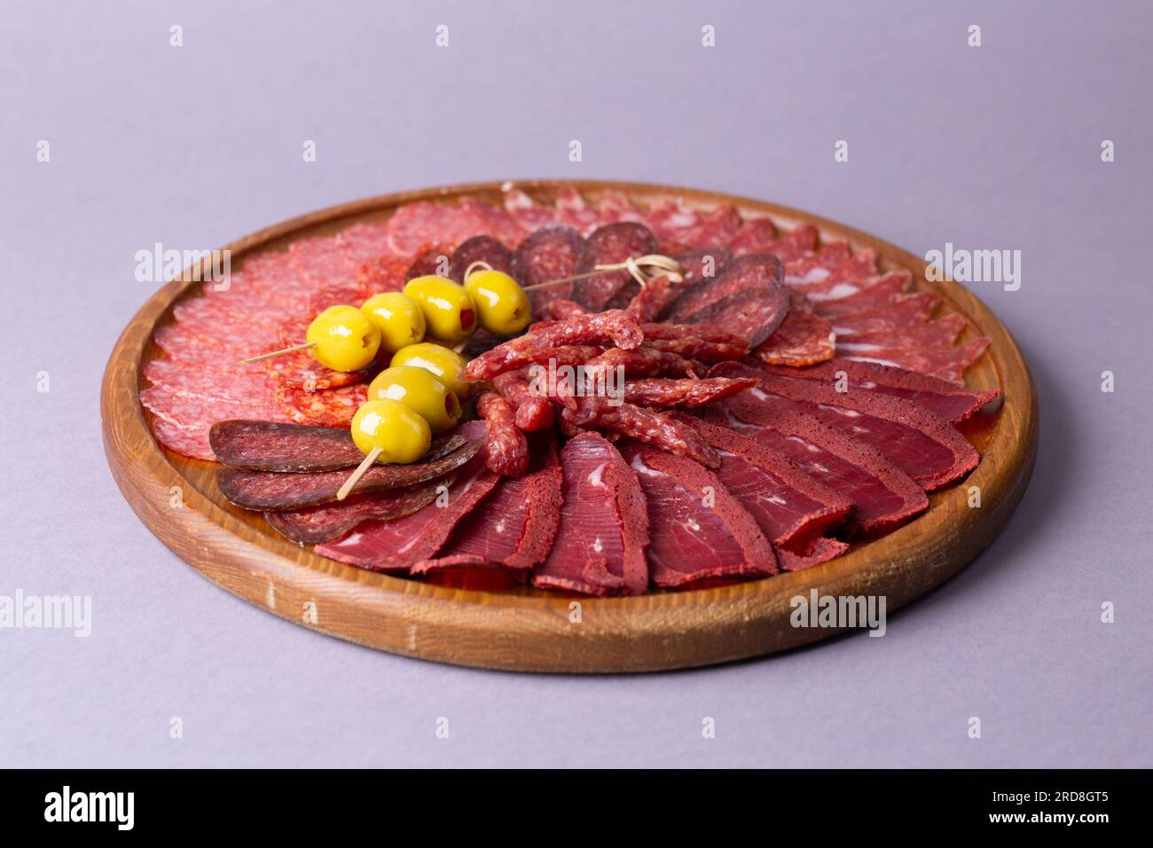 meat sliced from delicacies on a wooden stand Stock Photo - Alamy