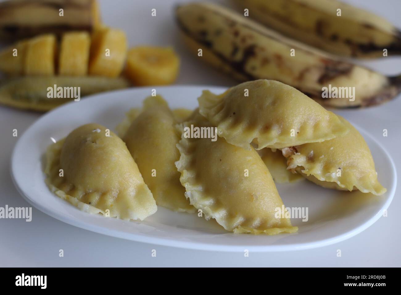 Plantain sweet dumplings or banana kozhukkatta. Steamed sweet dumplings ...