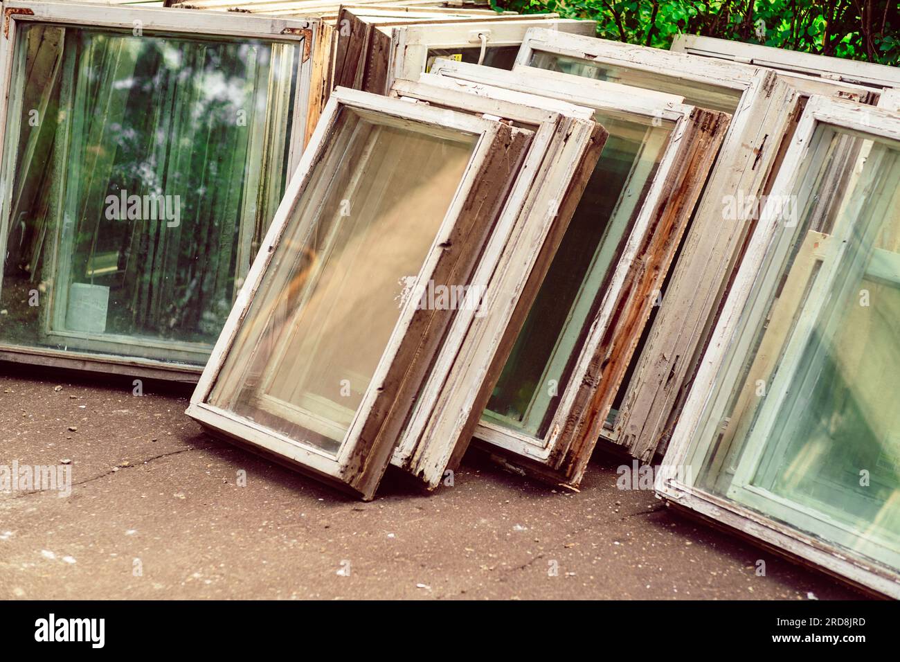 Bunch of old wooden windows frames on the street. Replacement of ...