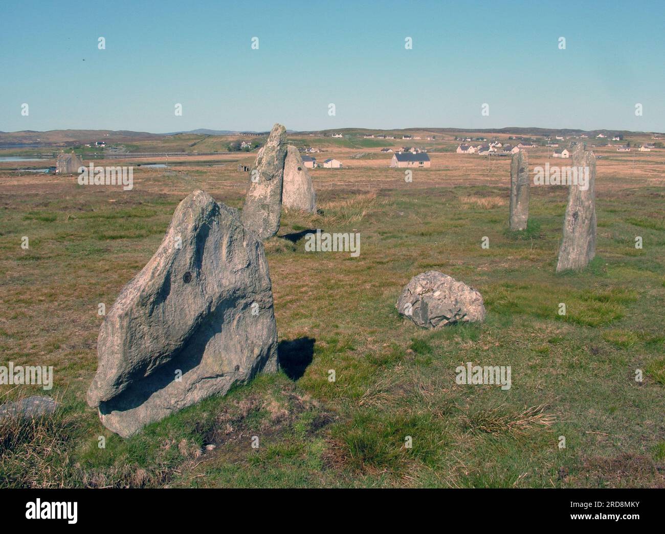 Standing stones with cottages in the background on the west coast of ...