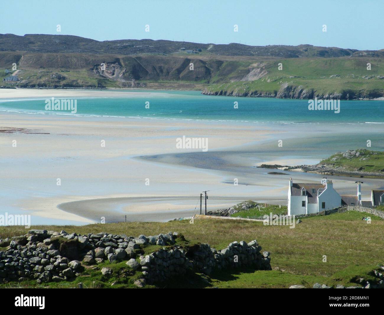 Ruins of a stone croft and a modern house share a splendid view over an ...