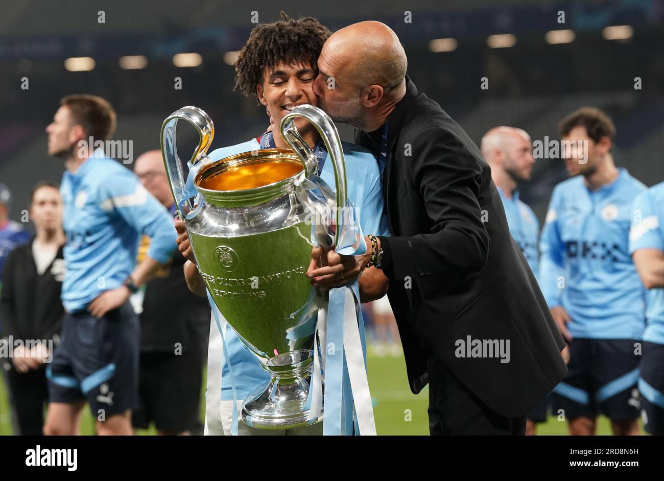 Manchester City manager Pep Guardiola kisses Rico Lewis (left) as they ...