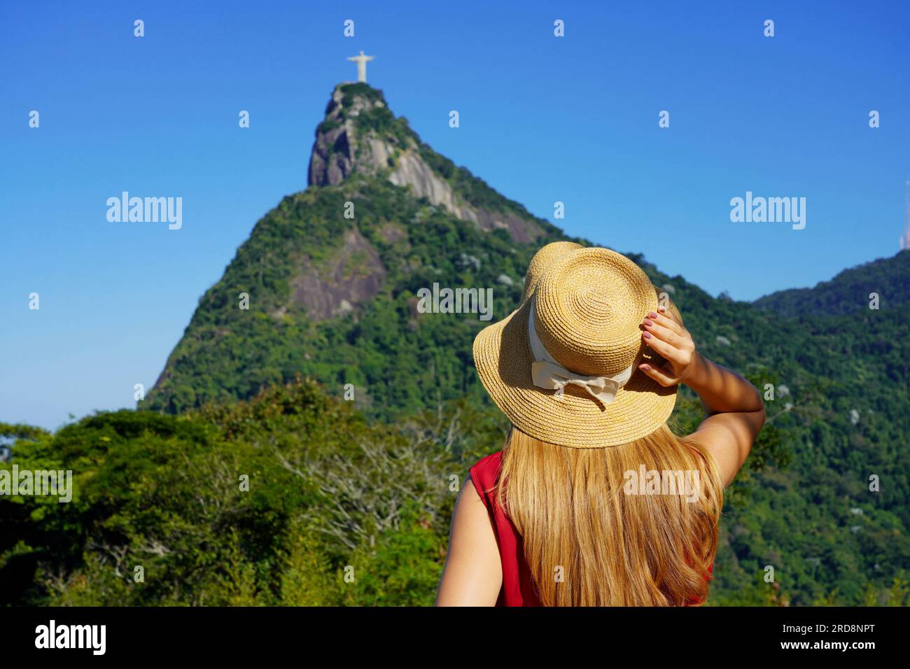 Tourism in Rio de Janeiro. Back view of tourist woman looking at Christ ...