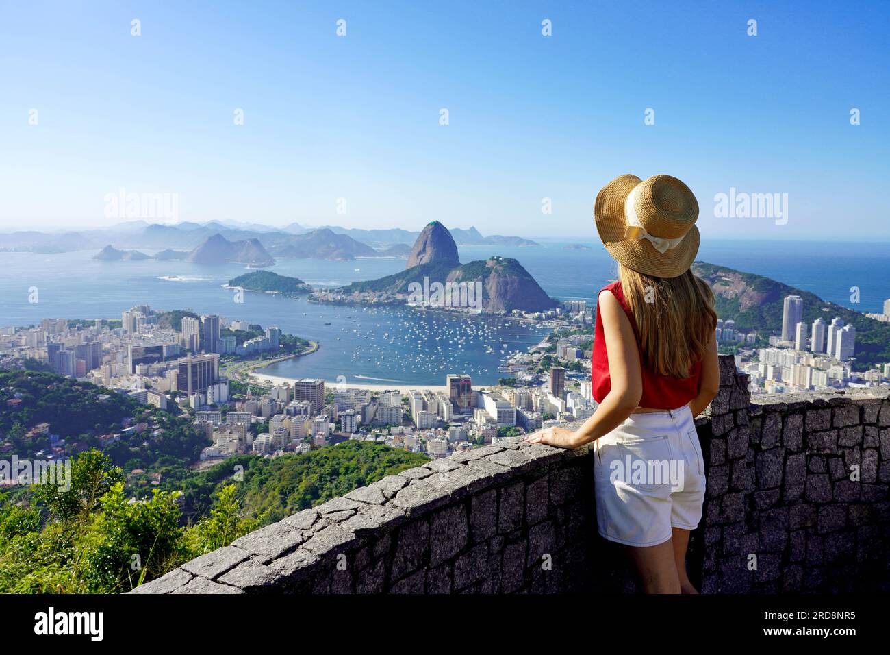 Tourism in Rio de Janeiro. Back view of traveler girl enjoying sight of ...