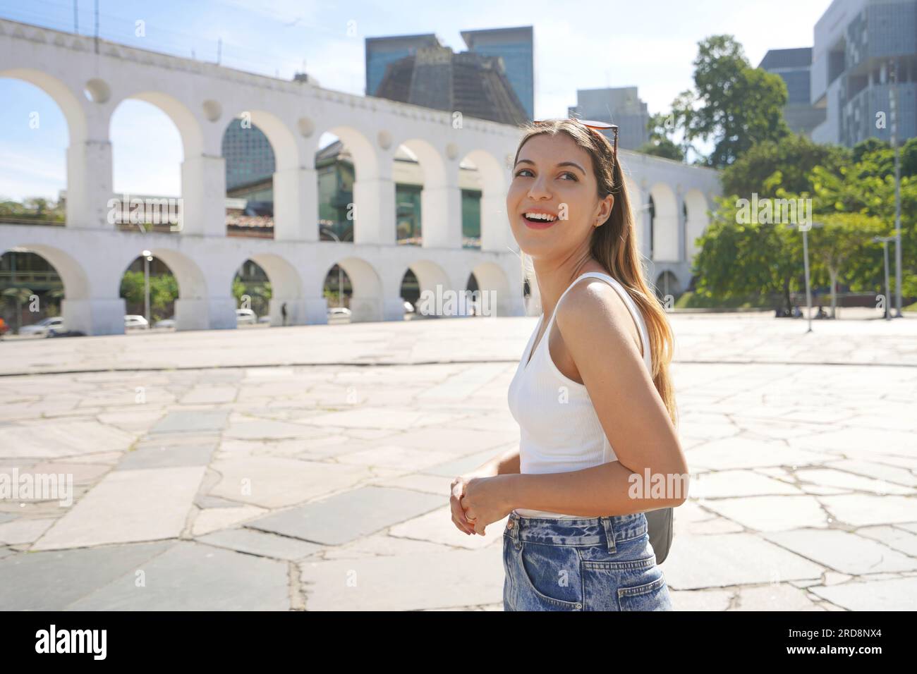 Beautiful girl walking in Lapa neighborhood with Carioca Aqueduct ...