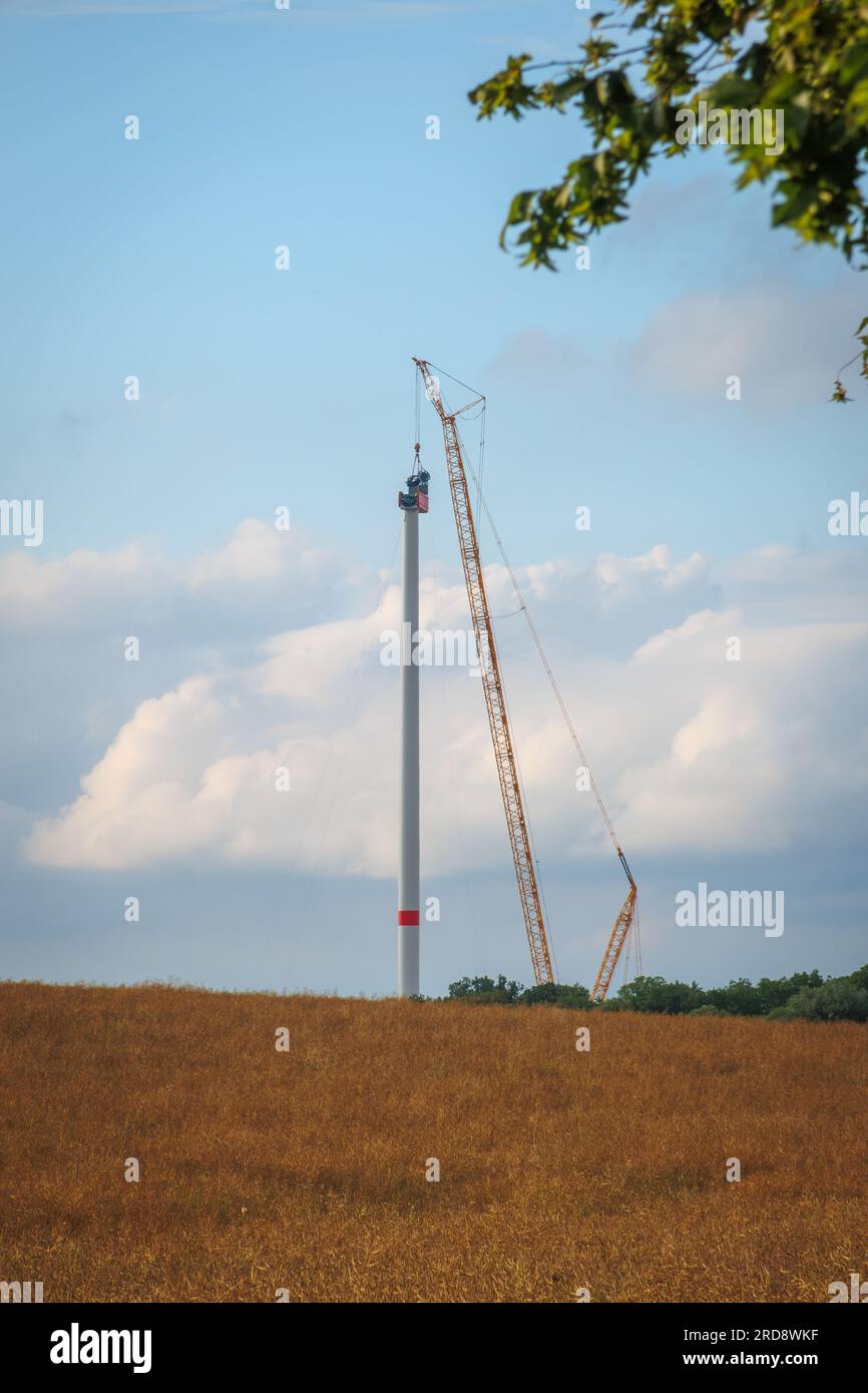 A turbine is inserted into the wind turbine pulpit with a crane Stock ...