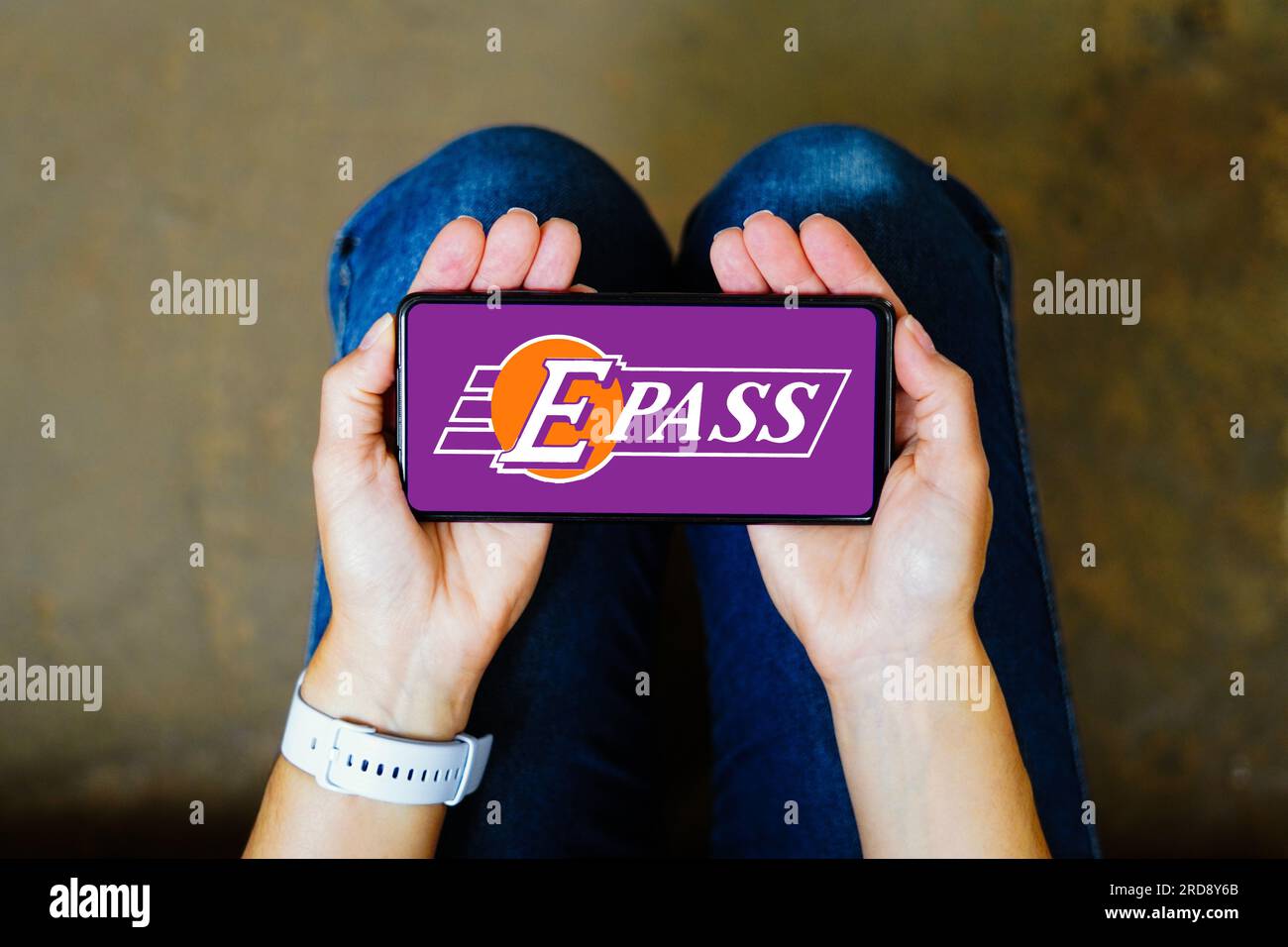 In this photo illustration, the E-PASS logo is seen displayed on a ...