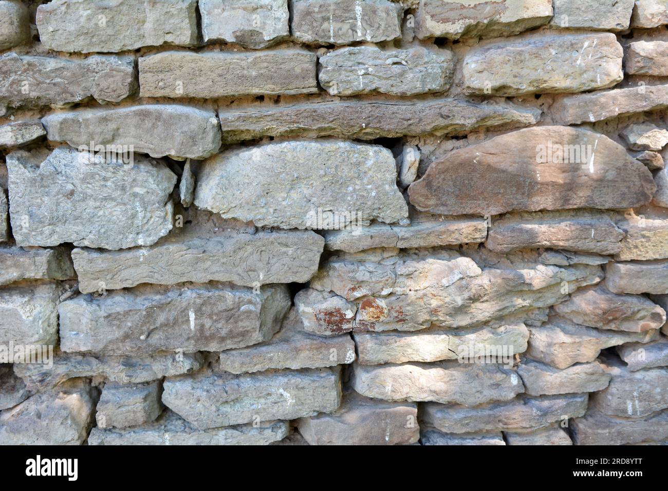 Old wall built of natural stone tiles Stock Photo - Alamy