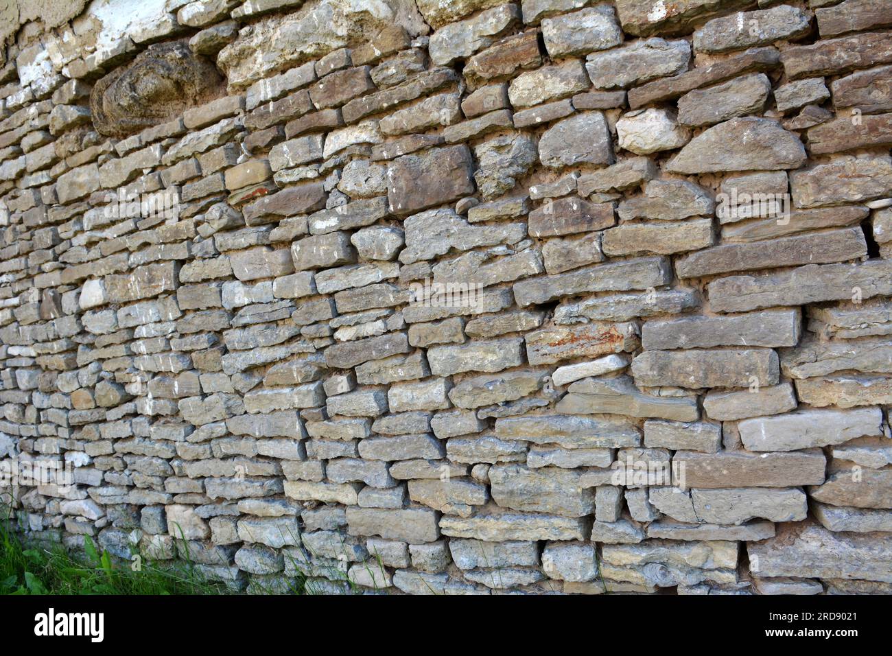 Old wall built of natural stone tiles Stock Photo - Alamy