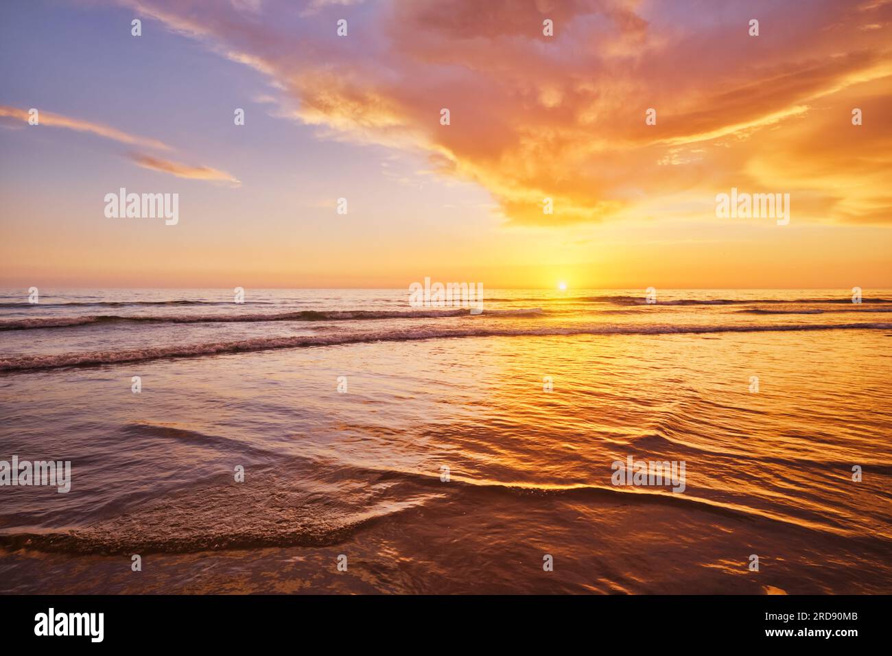 Atlantic ocean sunset with surging waves at Fonte da Telha beach ...