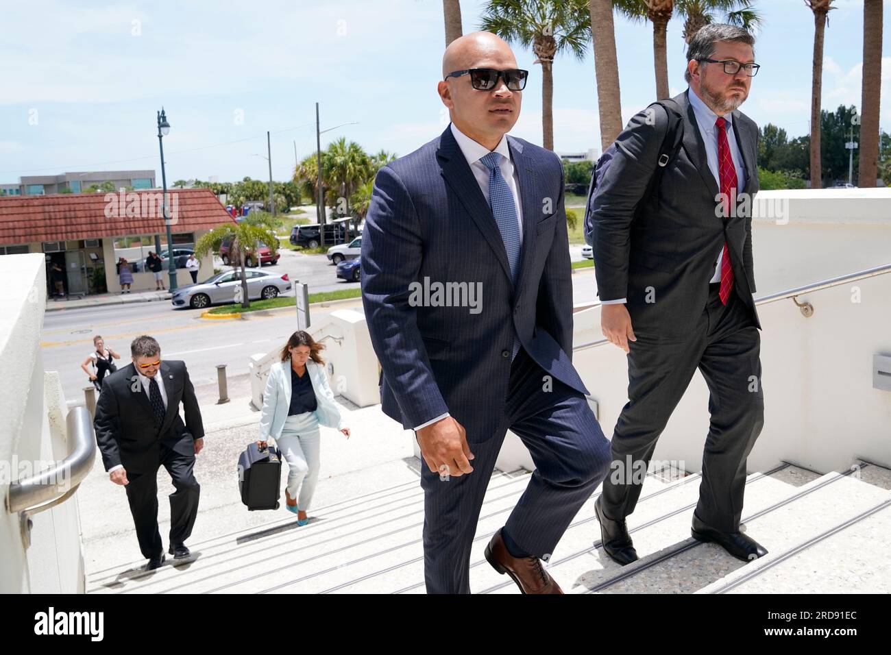 Walt Nauta, a valet to former President Donald Trump, left, arrives ...