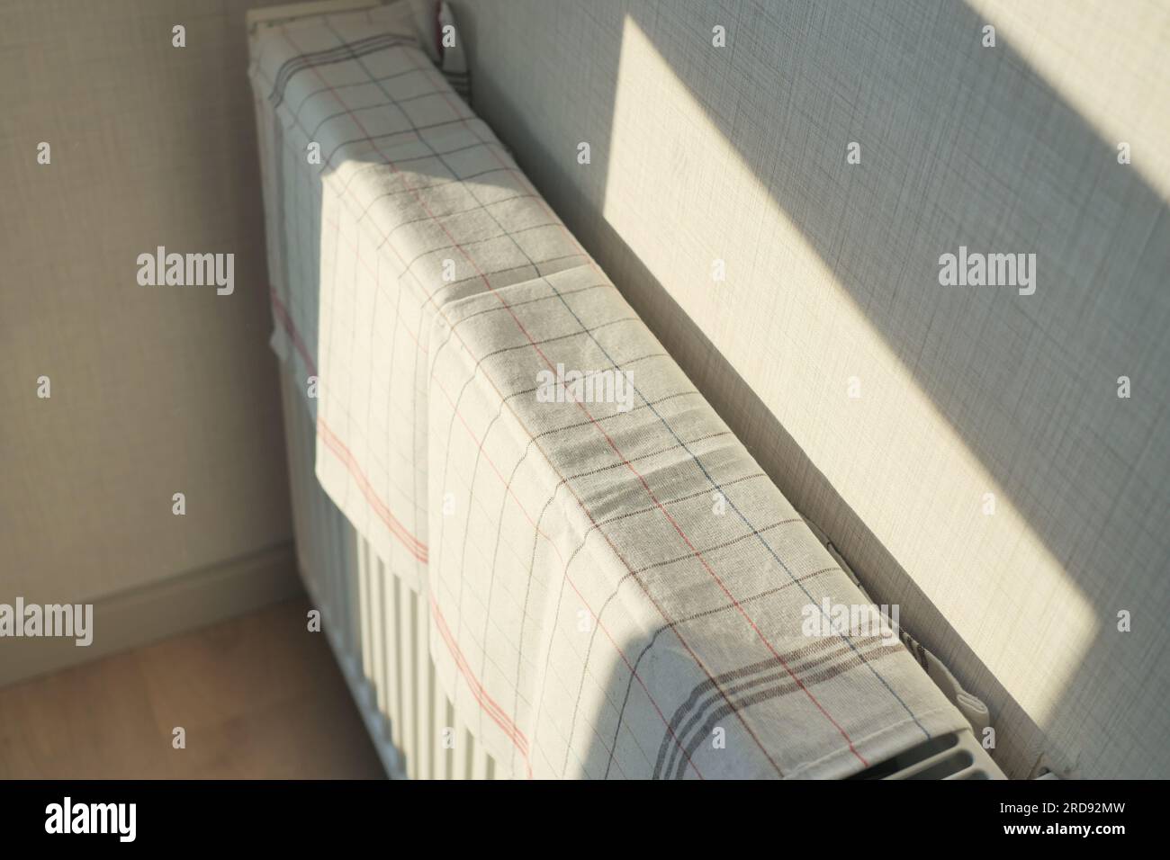 towel drying on heating radiator Stock Photo - Alamy