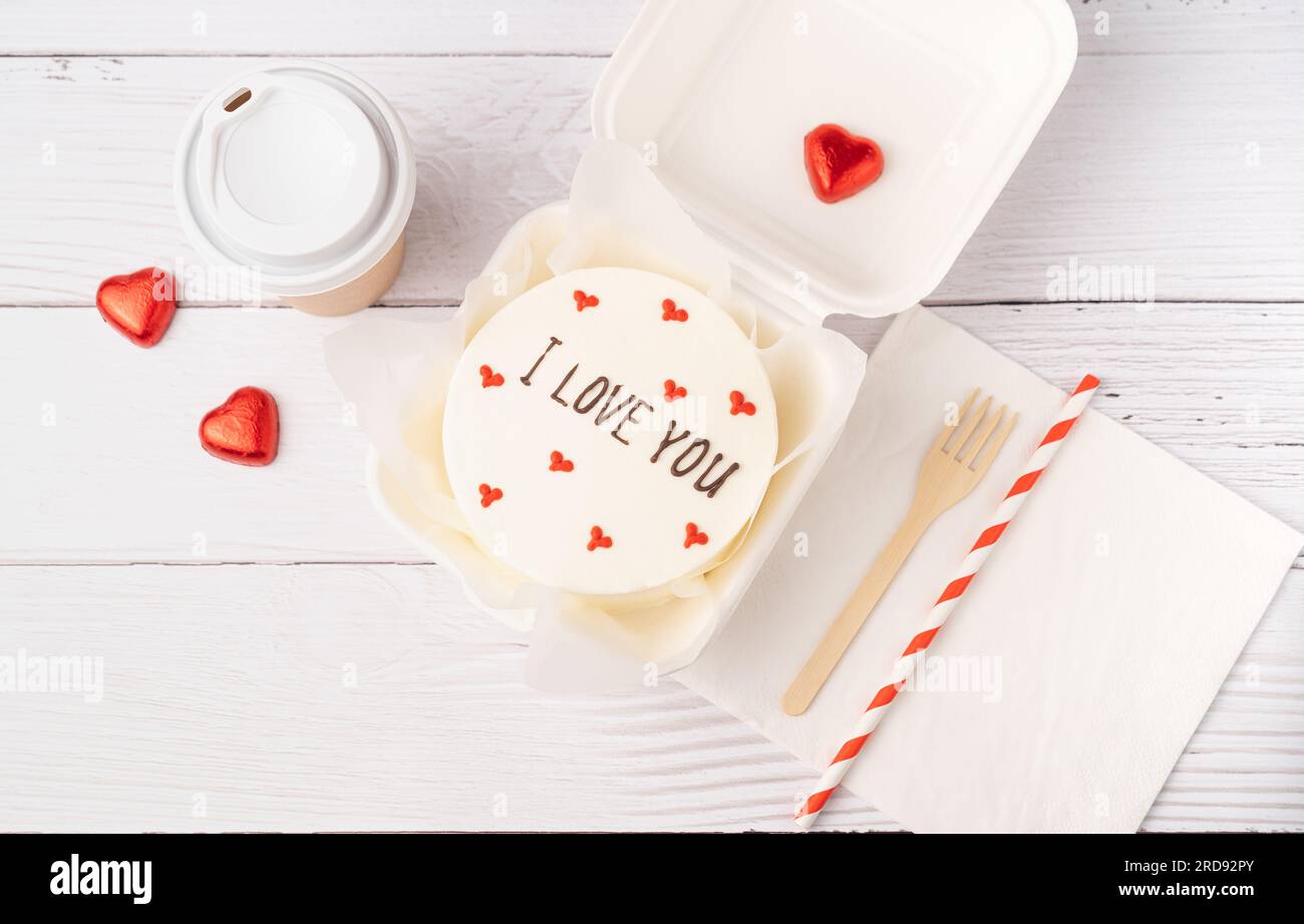 Flat lay with bento cake In box on the white wooden background Stock ...