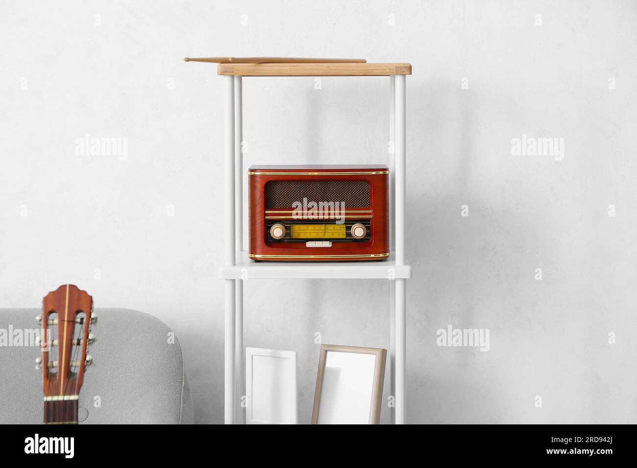Retro radio receiver on shelf in room Stock Photo - Alamy