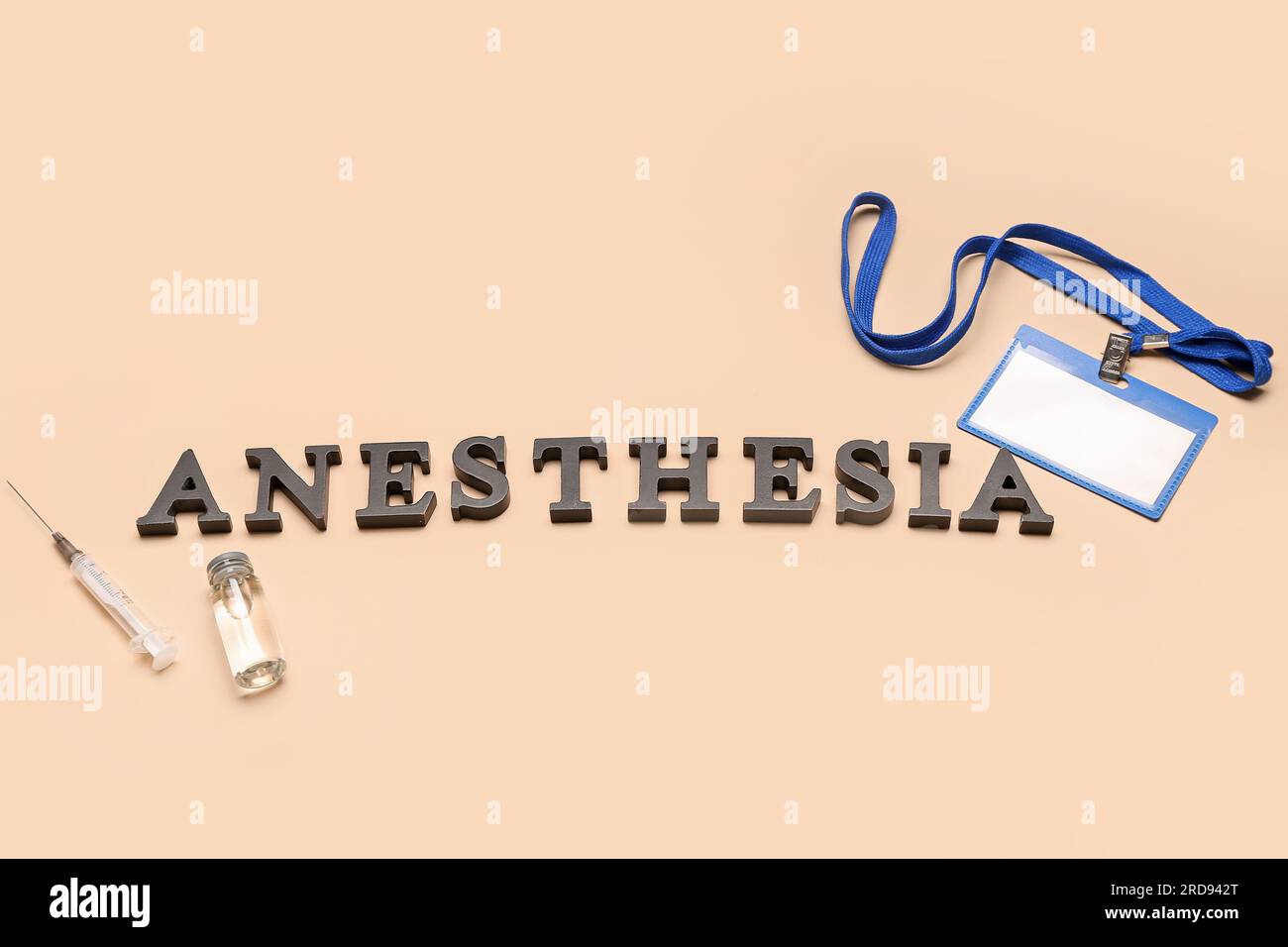 Word ANESTHESIA with badge, syringe and ampule on beige background ...