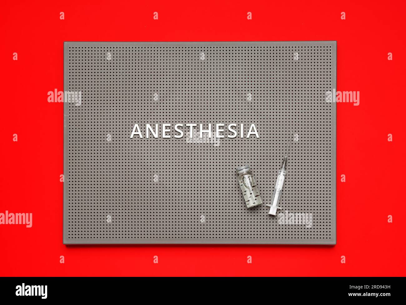 Board with word ANESTHESIA, ampule and syringe on red background Stock ...
