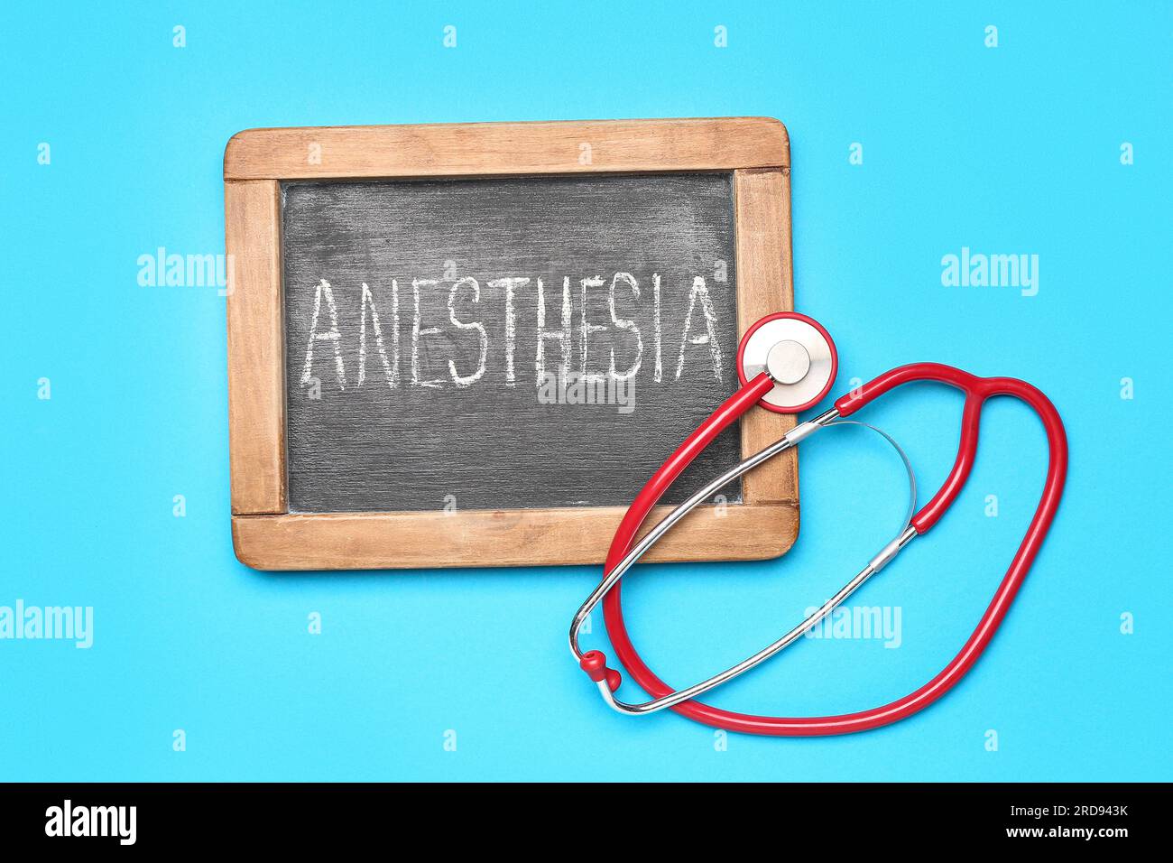 Chalkboard with word ANESTHESIA and stethoscope on blue background ...