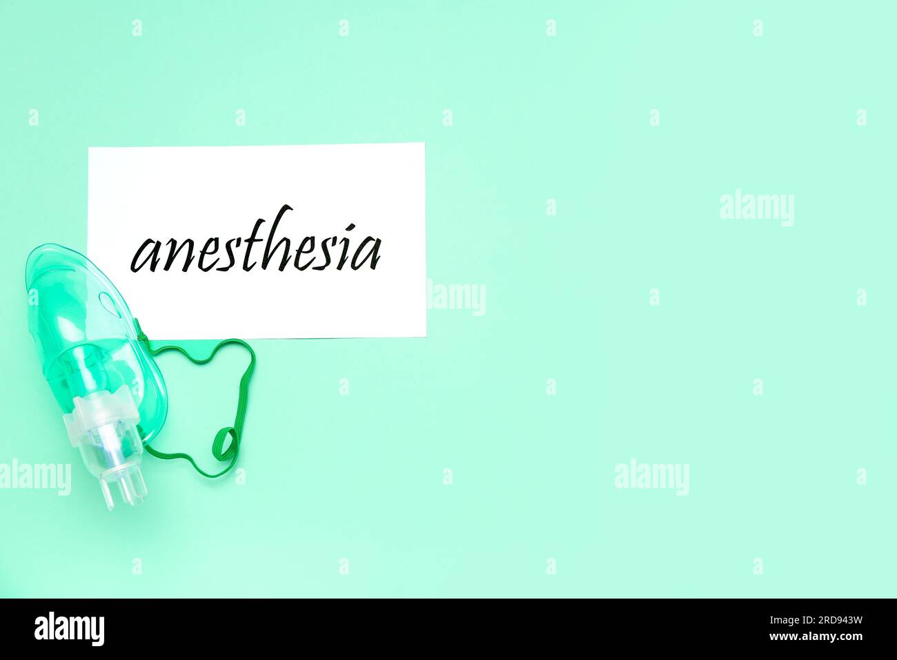 Paper with word ANESTHESIA and oxygen mask on green background Stock ...