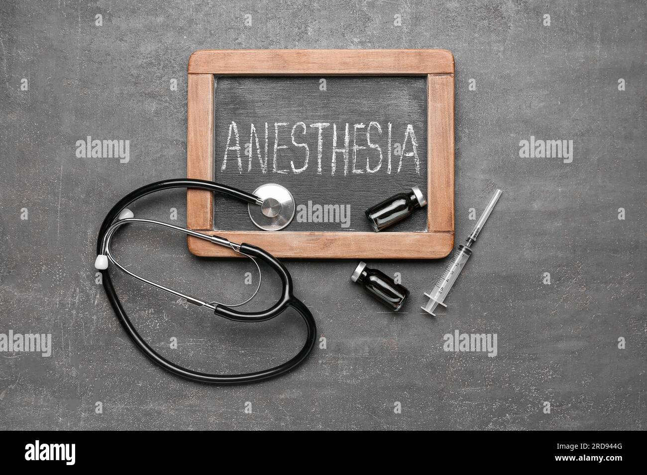 Chalkboard with word ANESTHESIA, stethoscope, ampules and syringe on ...