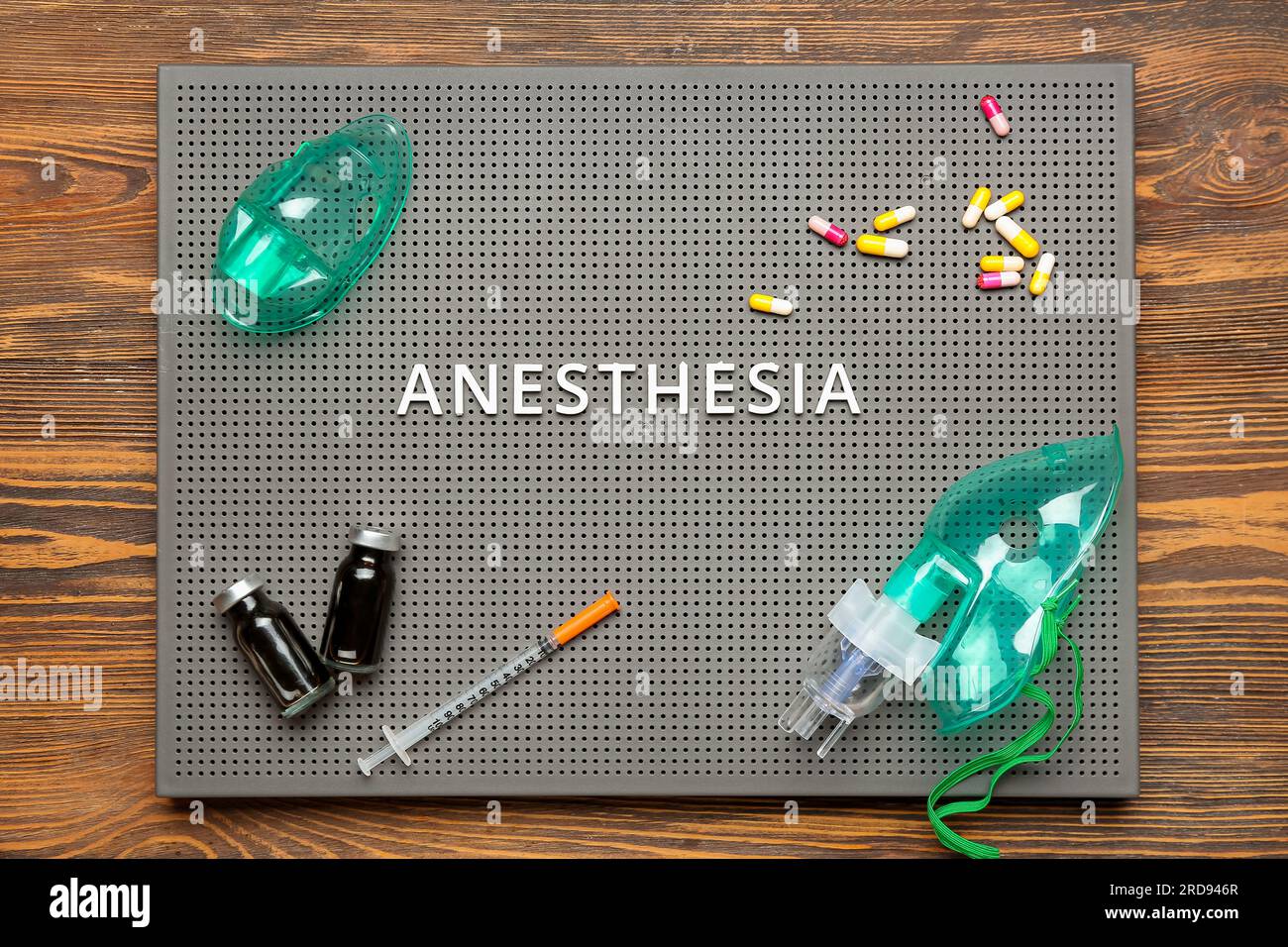 Board with word ANESTHESIA and medical supplies on wooden background ...