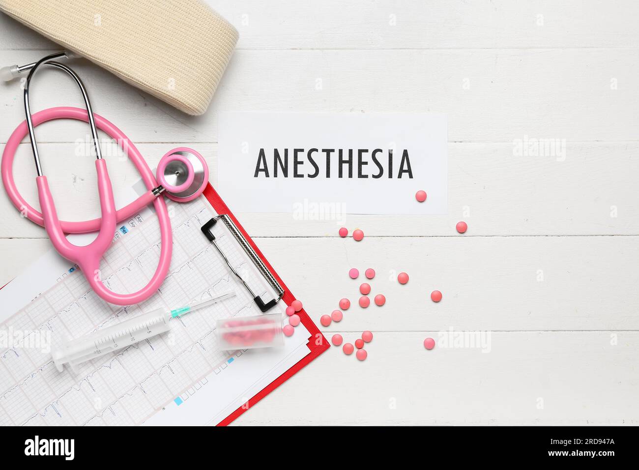 Paper with word ANESTHESIA, clipboard, stethoscope and pills on white ...