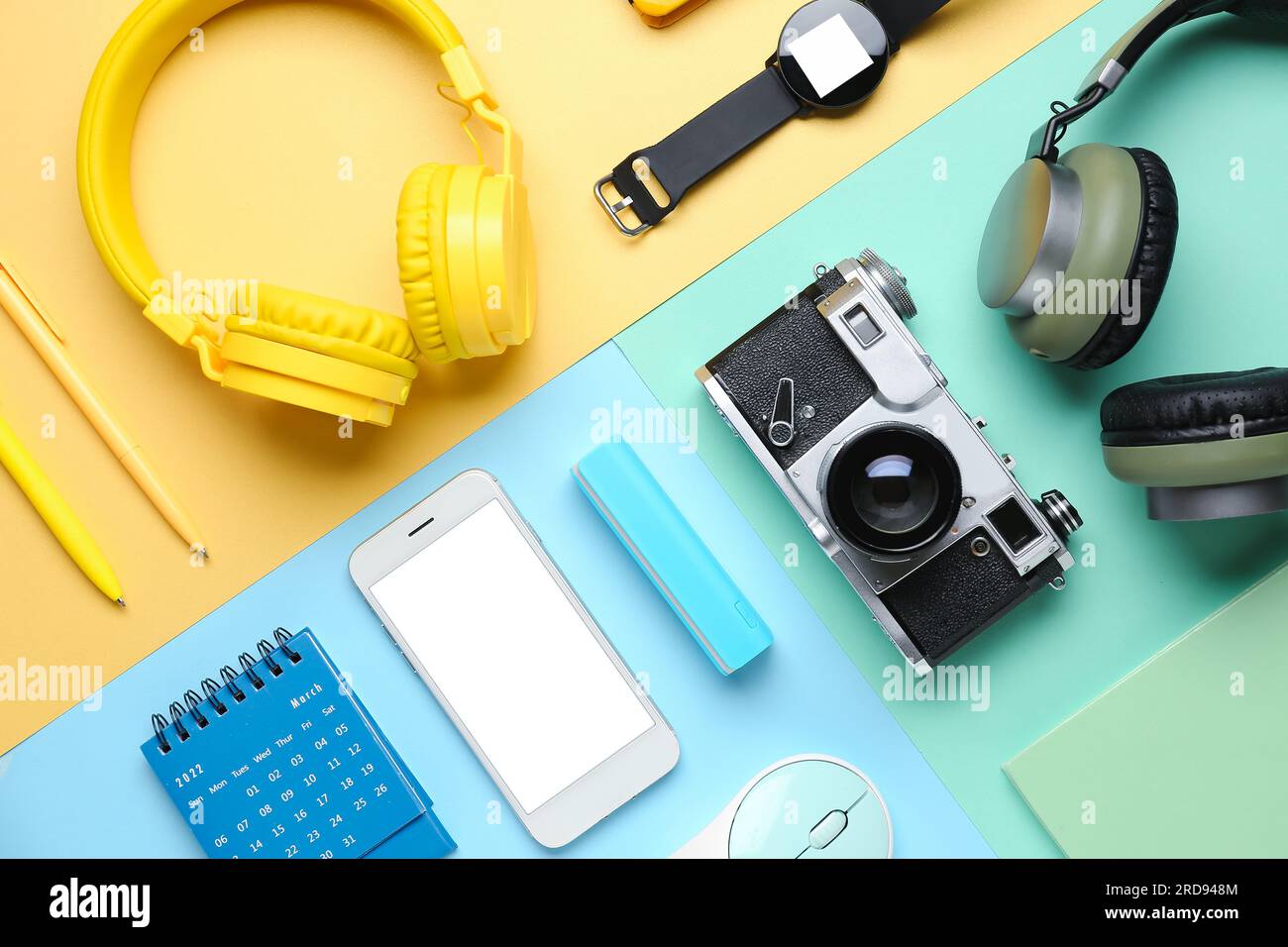 Composition with different gadgets and stationery on color background ...