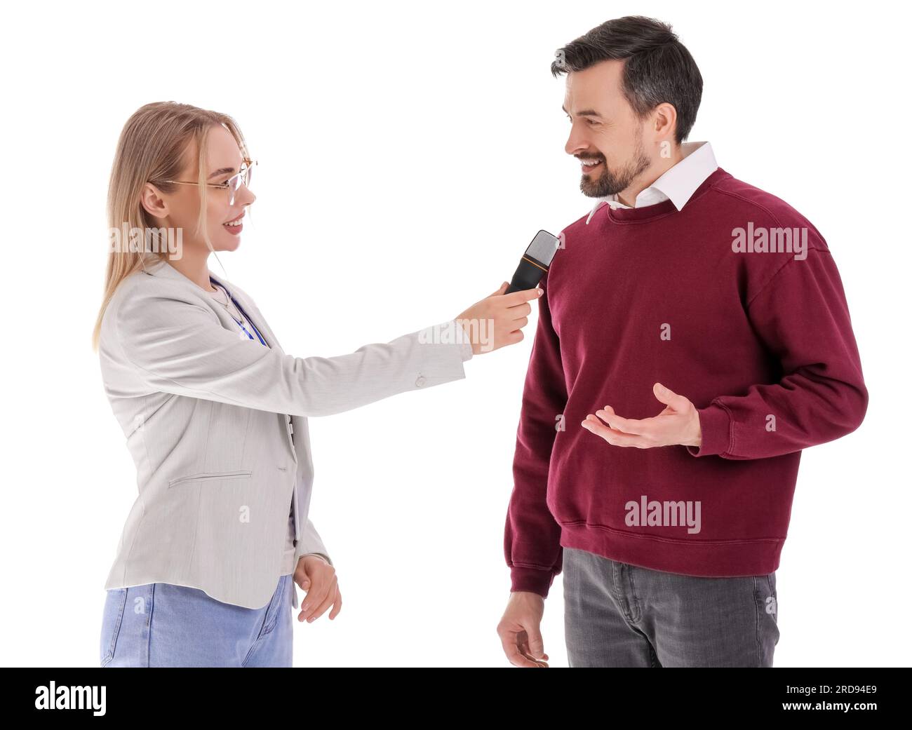 Female journalist with microphone having an interview with man on white ...
