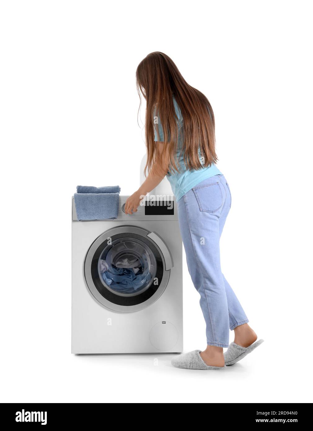 Woman setting up washing machine isolated on white background Stock ...