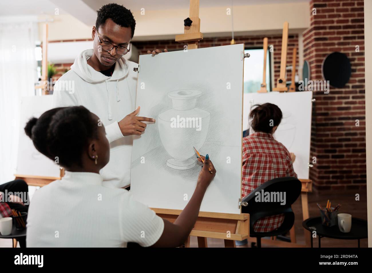 Young African American couple attending group art class together ...