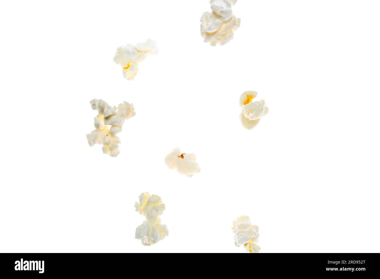 Flying tasty popcorn on white background Stock Photo - Alamy