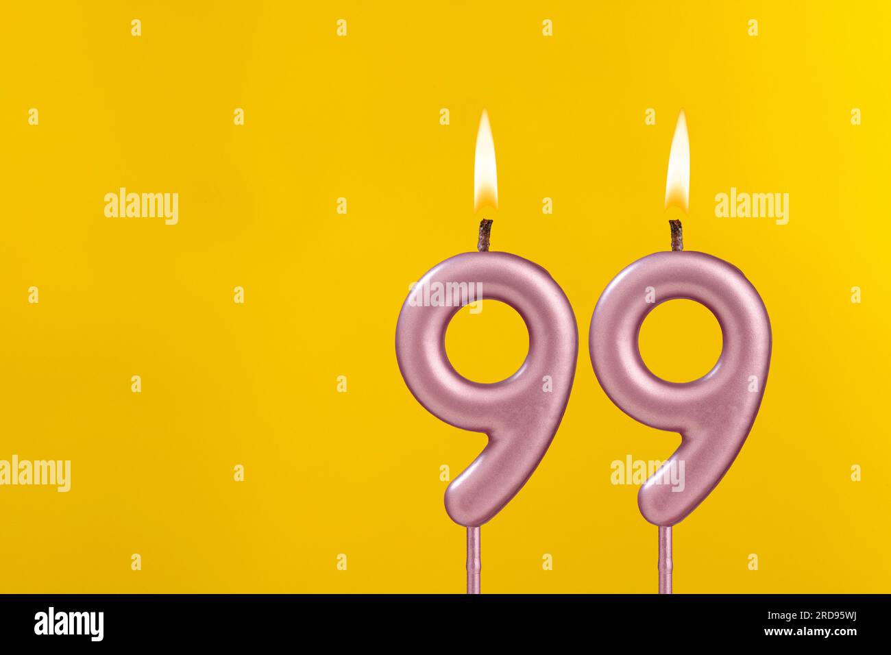 Birthday candle number 99 - Birthday celebration on yellow background ...